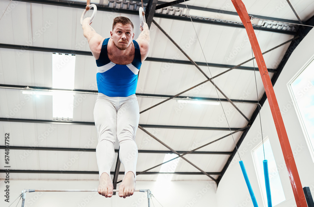 Man, acrobat and gymnastics balance on rings in fitness for practice ...