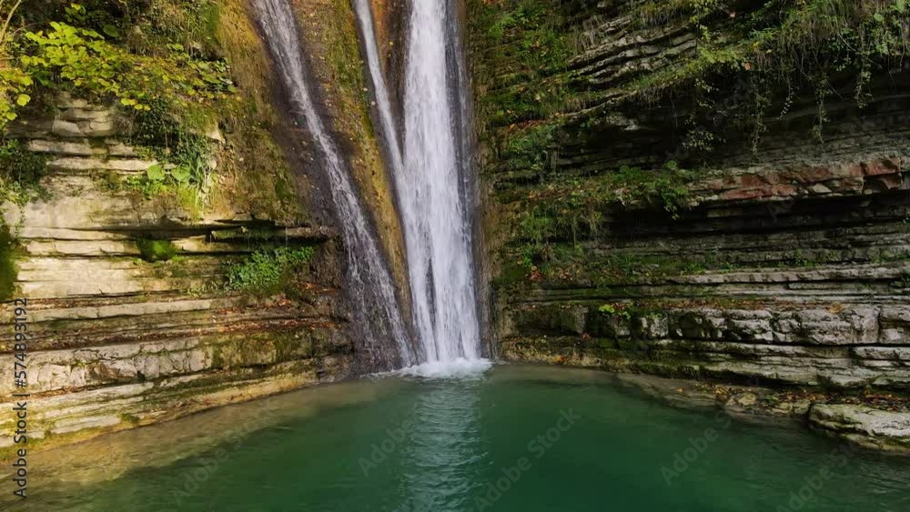 A waterfall pouring out of rocks eroded by streams. The lakes, called ...