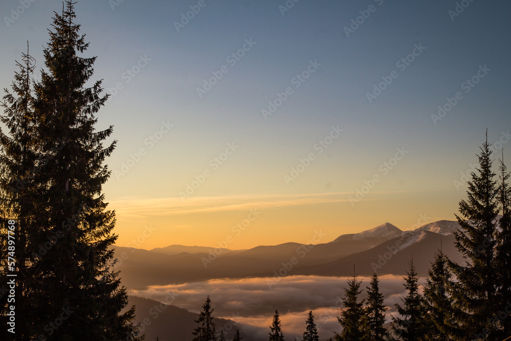Peaceful sunset view on mountain ranges and spruces landscape photo ...