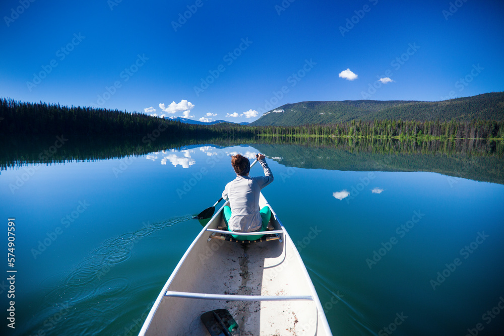 Canoeing across Unna Lake in Bowron Lake Provincial Park. Stock Photo ...