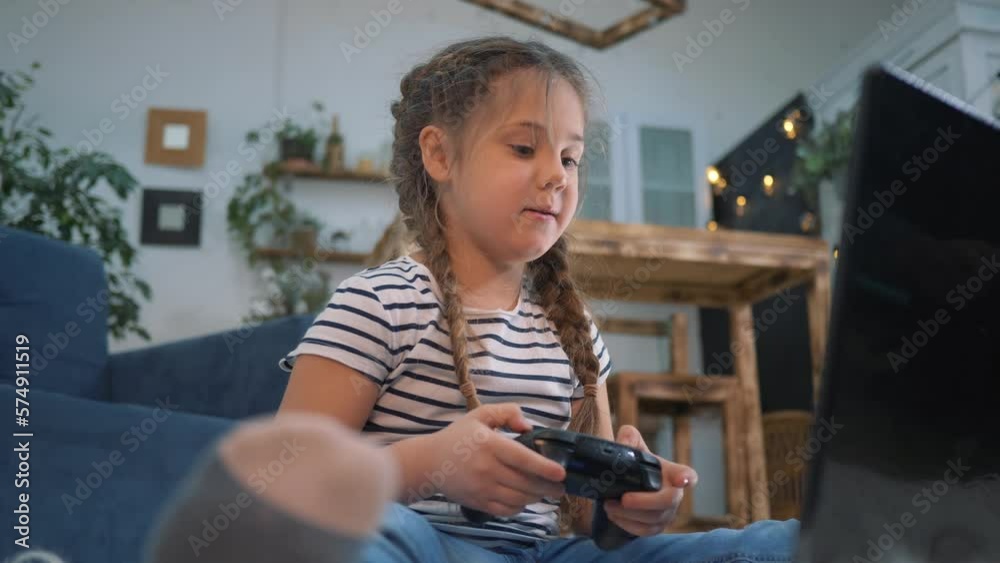 People playing video games. Happy cute kid gamer playing video game ...