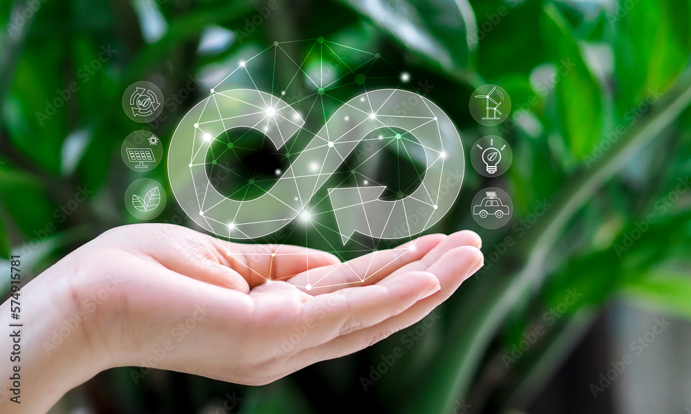 Hand hold the circular economy icon. icon ESG on the screen in ...