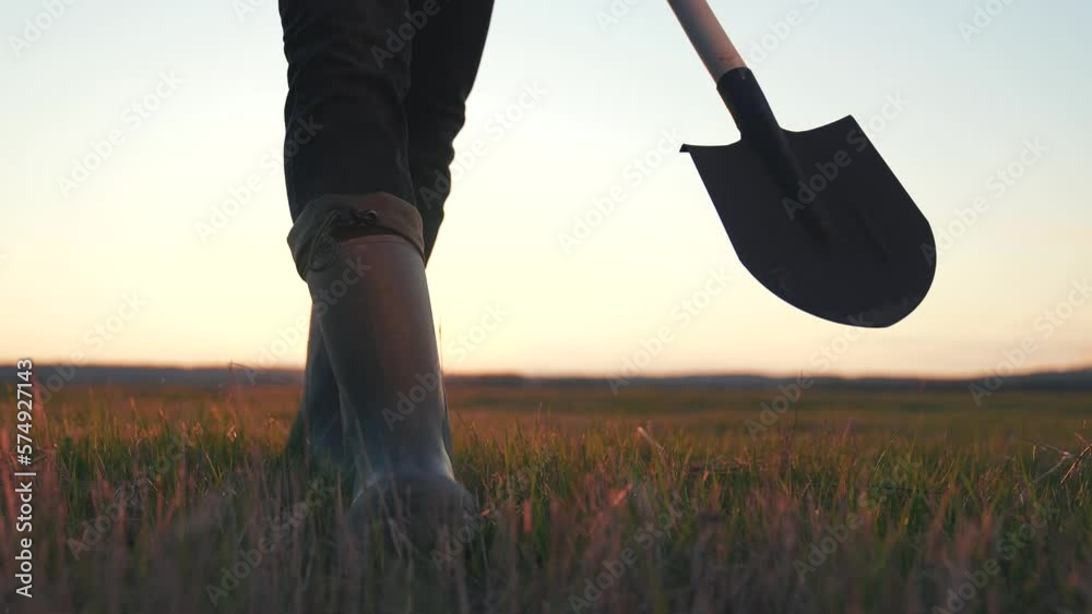 Video Stock Agricultural business. Large feet in rubber boots walking ...