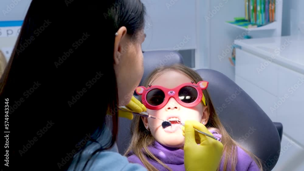 pediatric dentistry close-up little girl opened mouth shows teeth ...