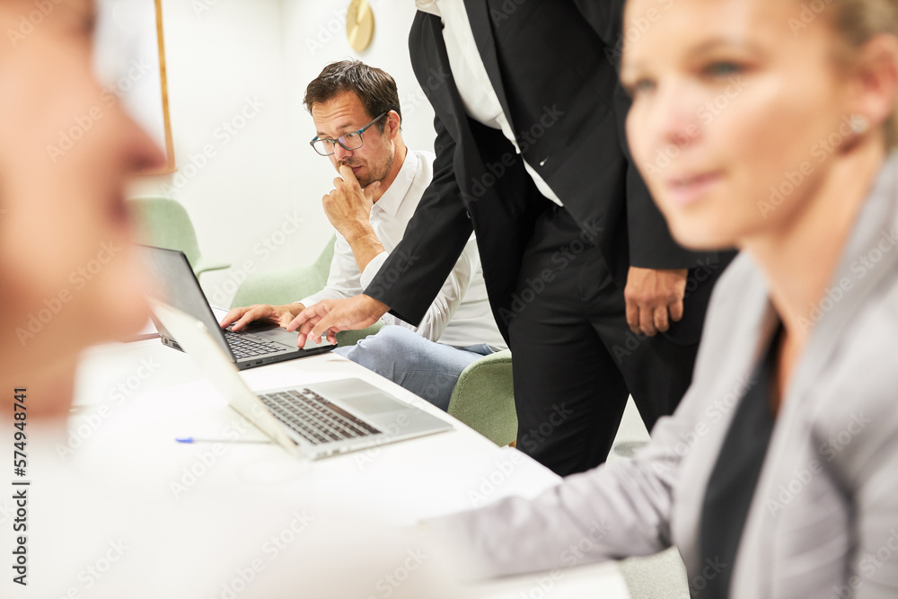 Thoughtful business man at the laptop computer Stock Photo | Adobe Stock