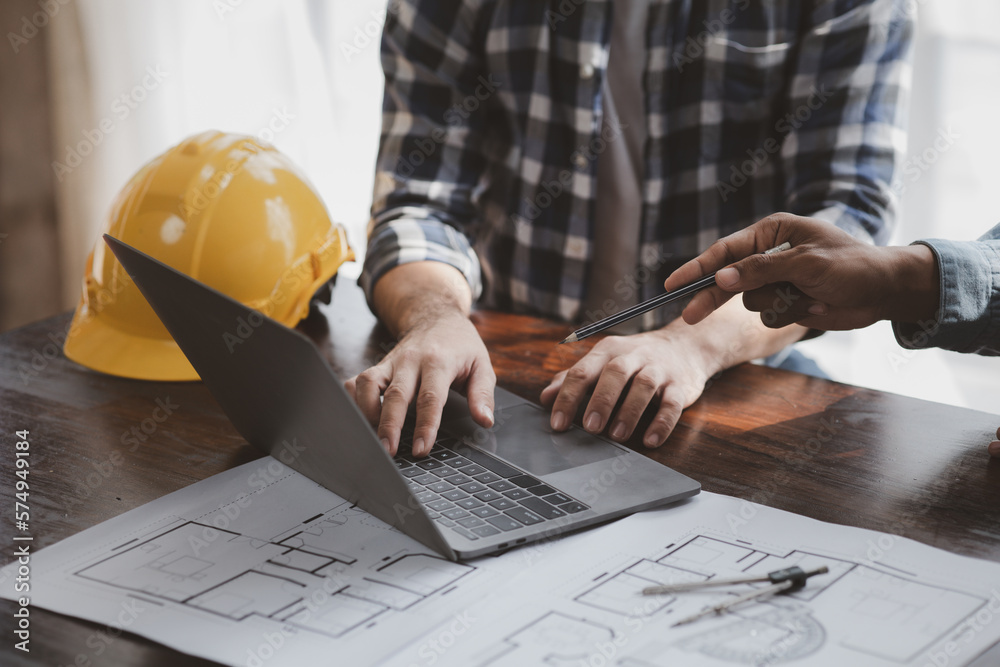 Foto de The home design architects are reviewing the house plan draft ...