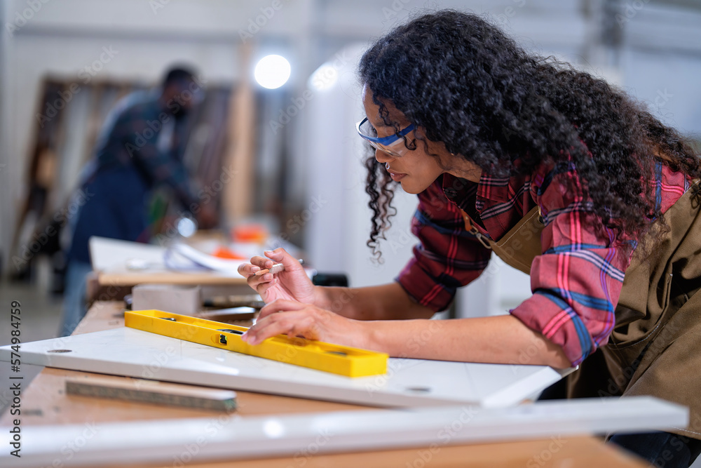 In work place carpenter man concentrate on ruler pencil draw alignment ...