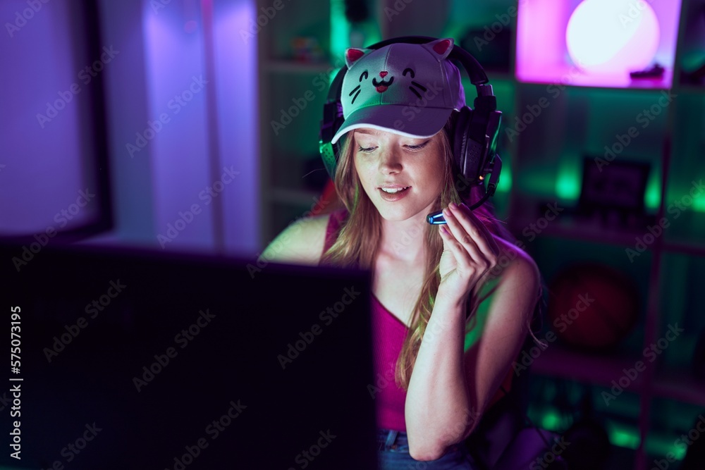 Young woman streamer using computer and headphones at gaming room Stock ...