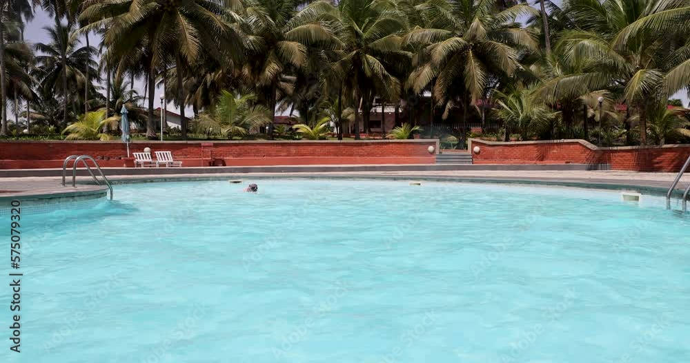 Cape Coast Ghana beach resort man swim pool. Luxury tropical resort on ...
