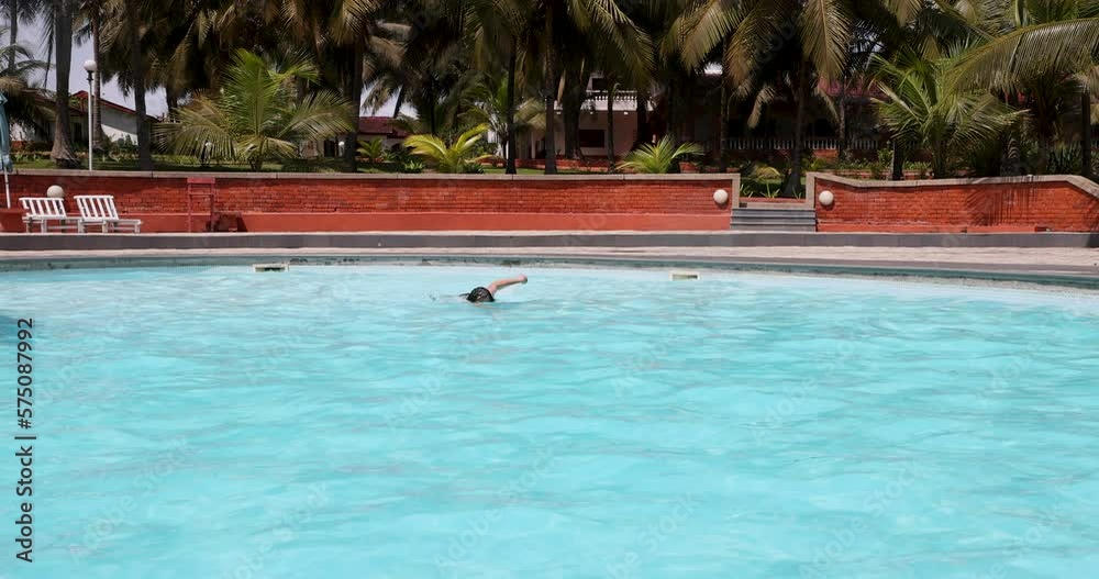 Cape Coast Ghana beach resort woman swim pool towards. Luxury tropical ...