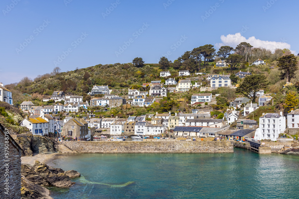 The fishing village of Polperro, with its harbour wall and narrow ...