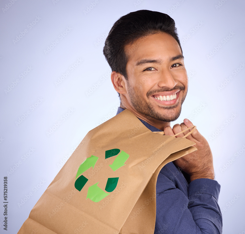 Man in portrait, happy and recycling paper bag, environment and ...