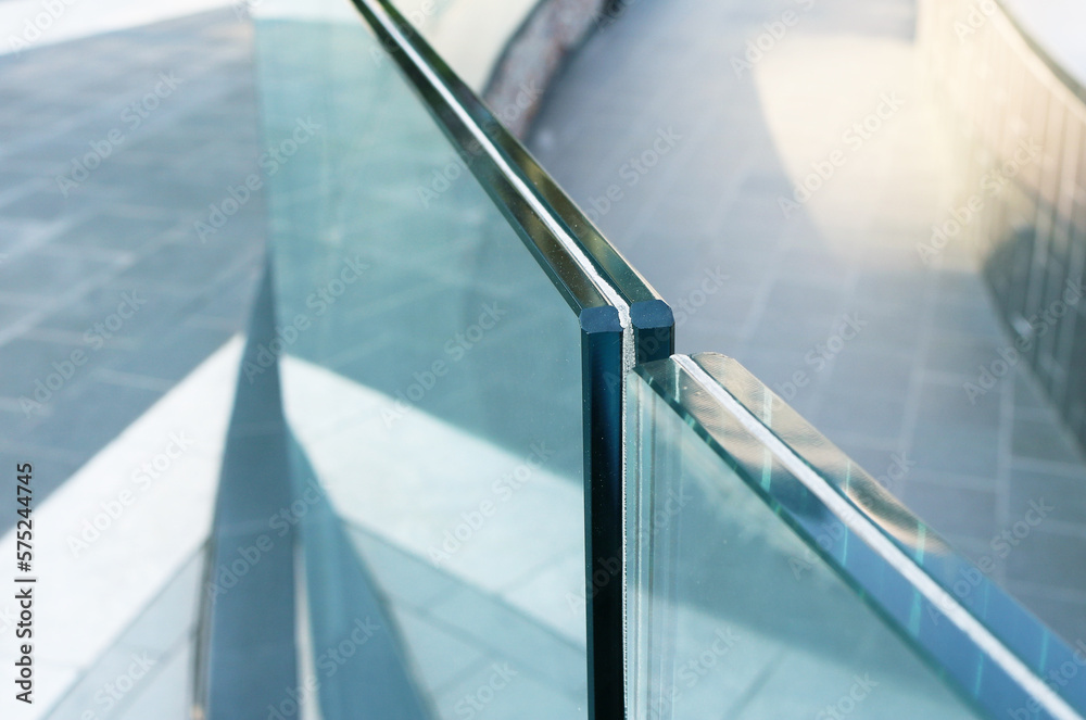 Closeup frameless laminated glass railing for exterior installation ...