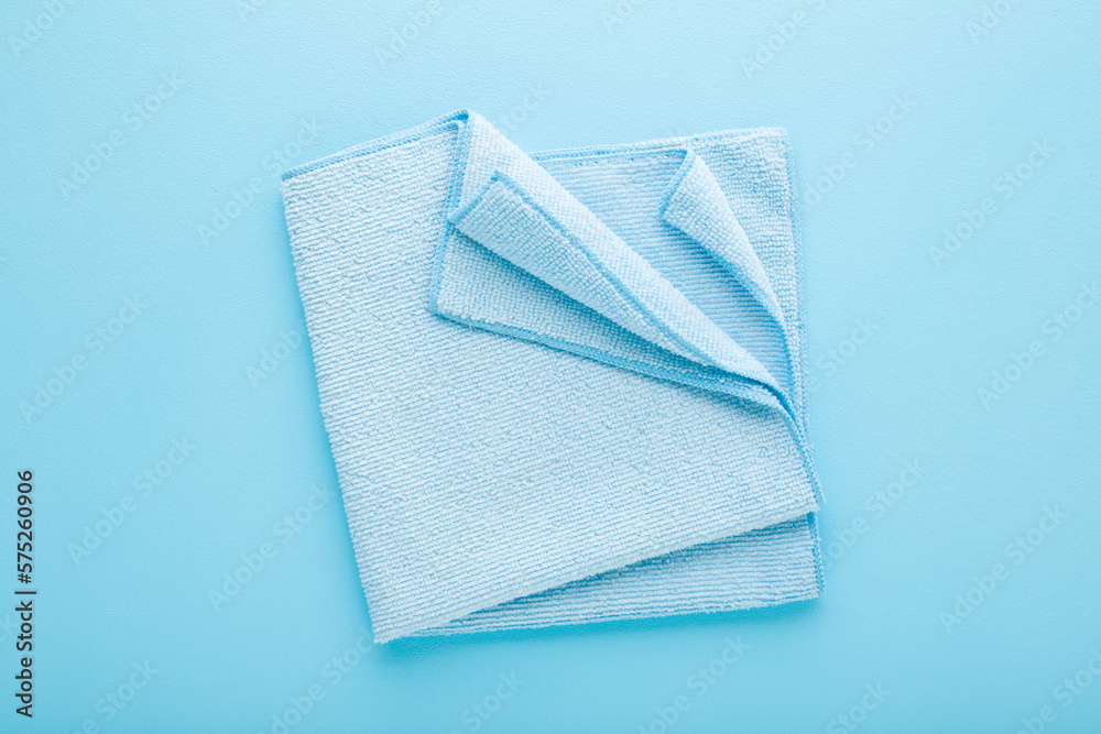 Folded dry soft microfiber rag for different surfaces wiping. Closeup ...