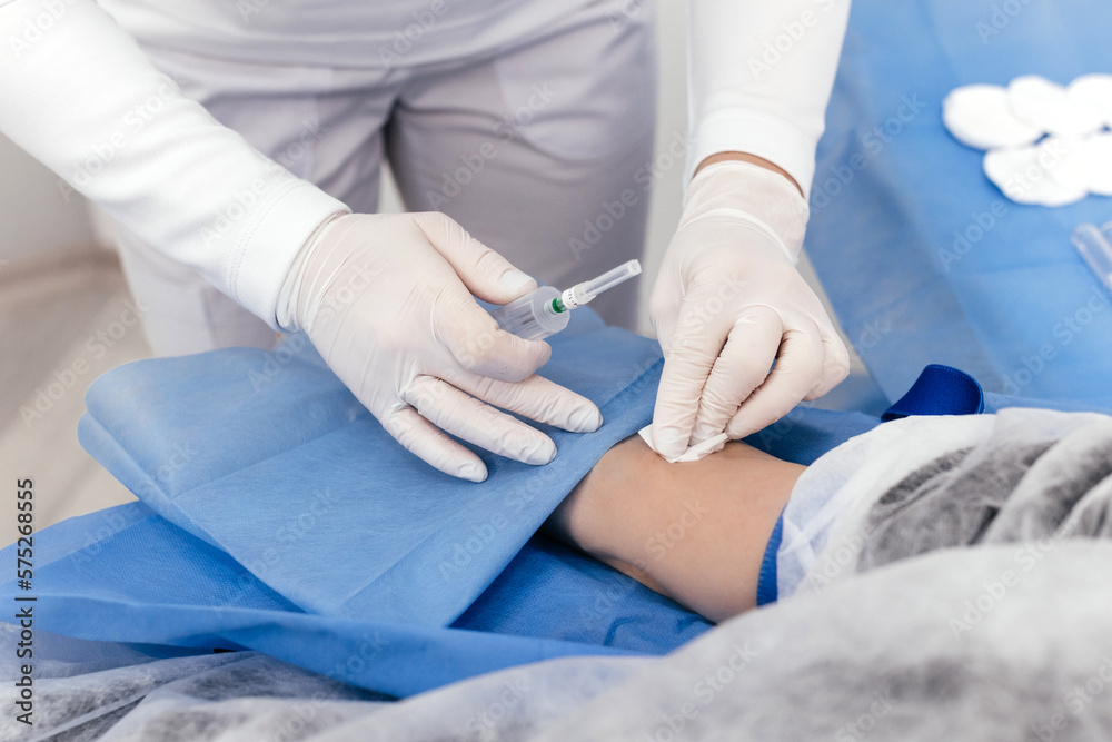 Laboratory worker doctor takes a blood sample for analysis, hand ...