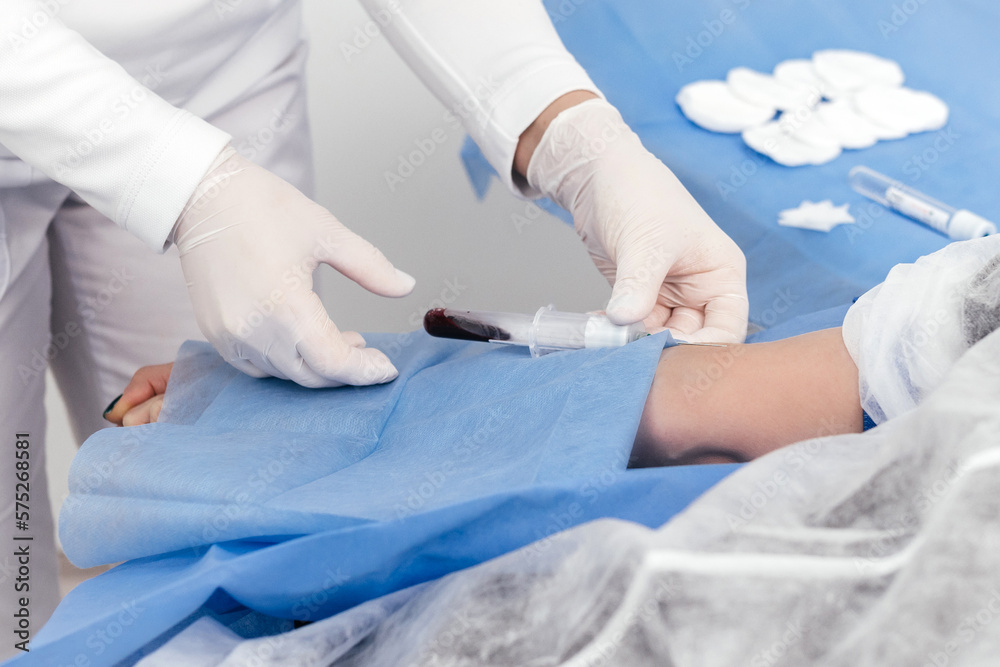 Laboratory worker doctor takes a blood sample for analysis, hand ...