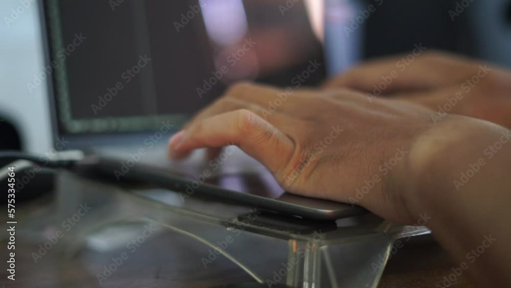 Defocus fingers typing and scrolling keyboard touchpad laptop close up ...