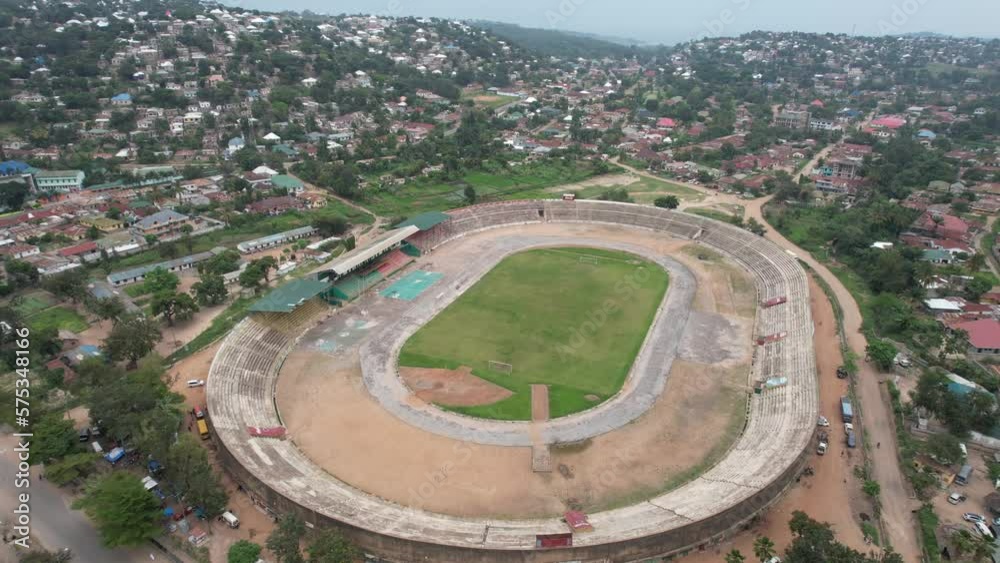 Aerial view of the CCM Kirumba Stadium next to Lake Victoria. Big arena ...