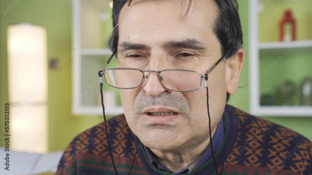 Emotional man crying alone at home. Sad and depressed old man suffering ...