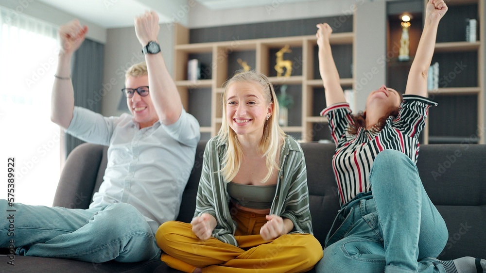 Cheerful happy Caucasian family cheering for favorite team and it ...