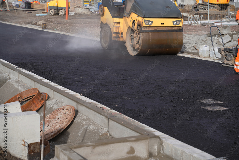 Asphalting of a new road on a construction site housing construc Stock ...