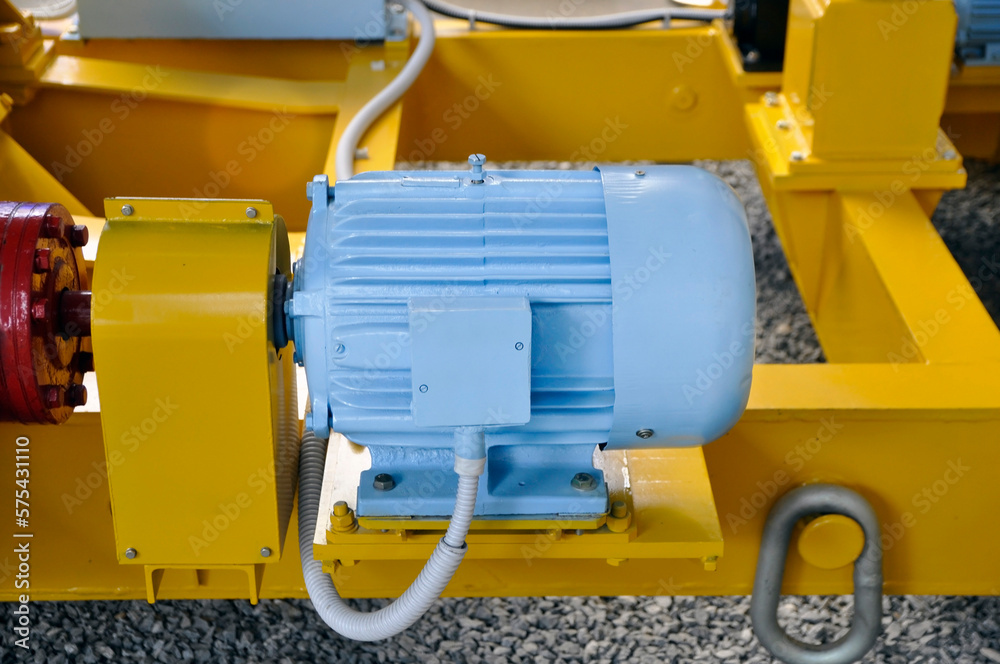 An electric motor on a construction hoist. Stock Photo | Adobe Stock