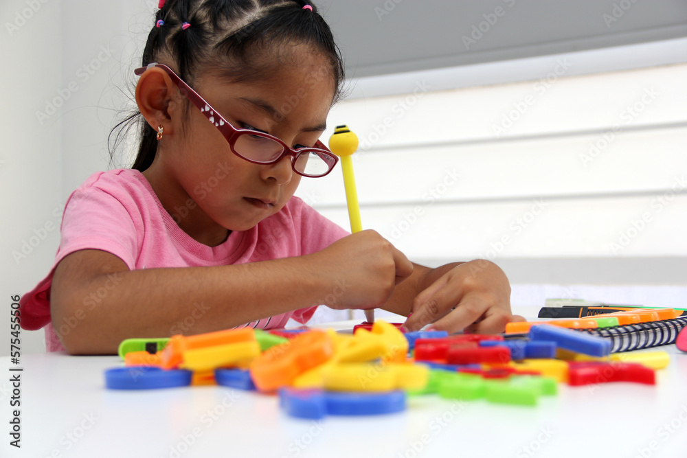 4-year-old brunette Latina girl with autism spectrum disorder ASD like ...