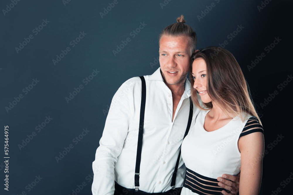 romantic blonde couple look to side at left corner with happy face ...