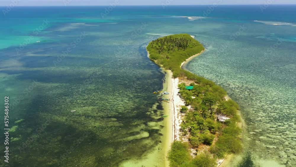 Island with a sandy beach and azure water. Tanduyong Island ...