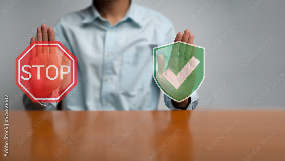 A man put hands to show symbol of stop and safety or approved. A green ...