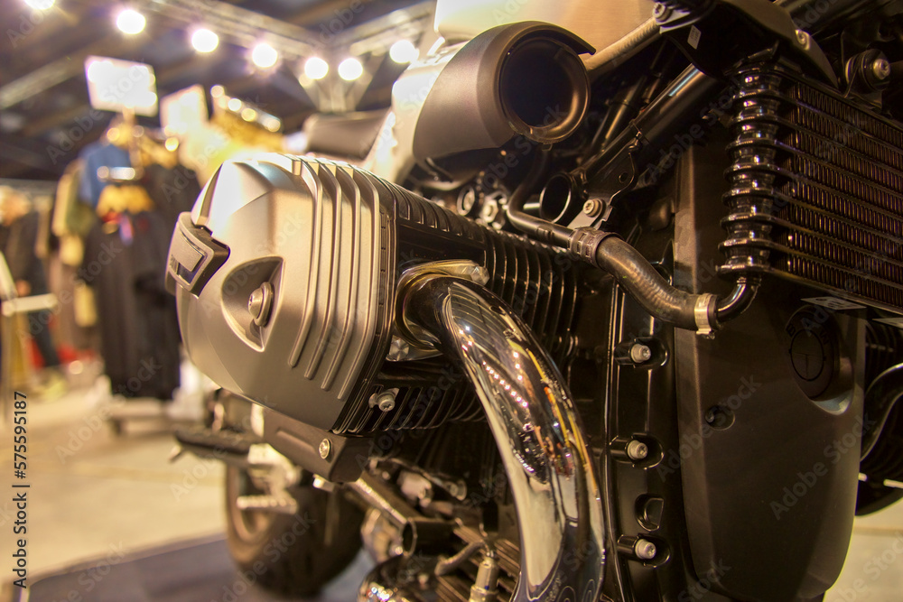 Detailed view of the engine and exhaust of a motorcycle with a ...