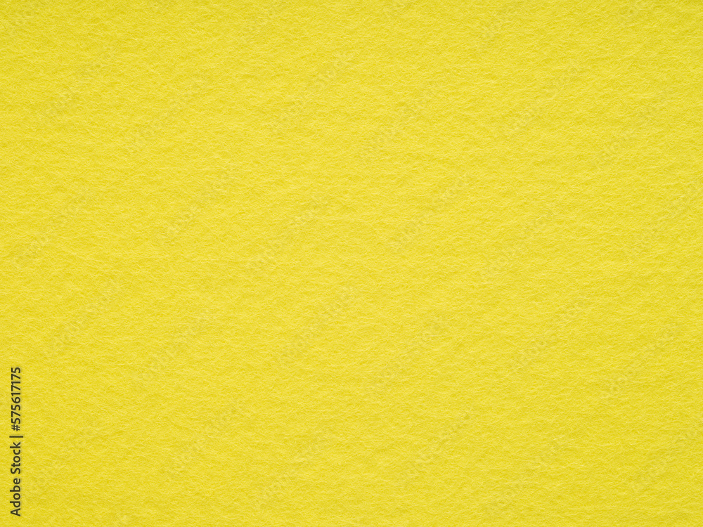 Bright yellow matt felt material blank. Surface of felted fabric ...