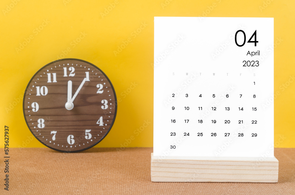 The April 2023 Monthly calendar for 2023 year with clock on yellow ...