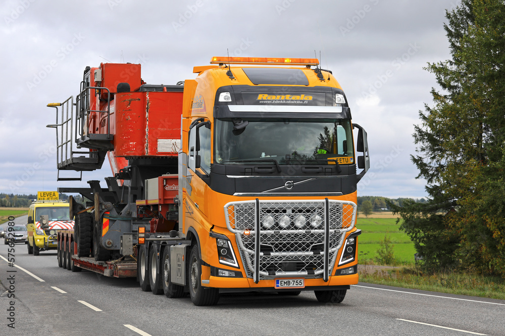 Yellow Volvo FH16 Truck Hauls Oversize Load in Traffic, Escort Vehicle ...