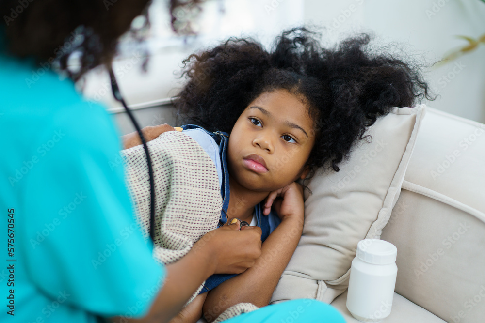 African American ethnicity female doctor and little girl in hospital ...