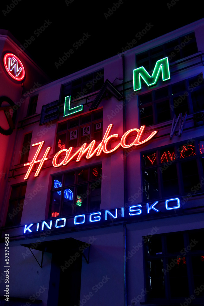 Ruska street in Wroclaw city with glowing neon signs on buildings at ...