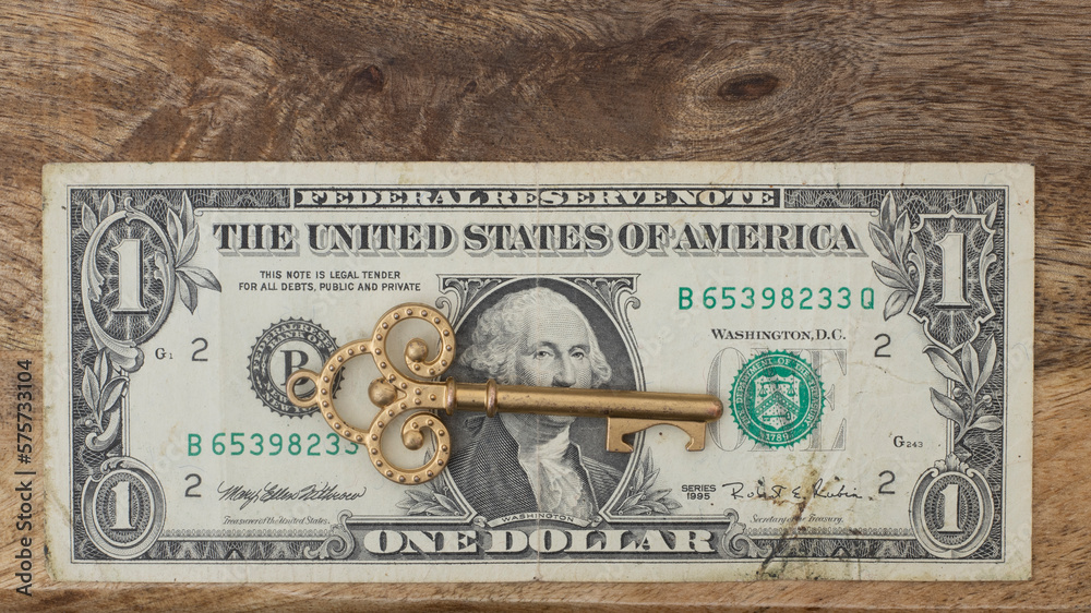 Dollar bill with old vintage key. Money opens many doors. Ancient key ...