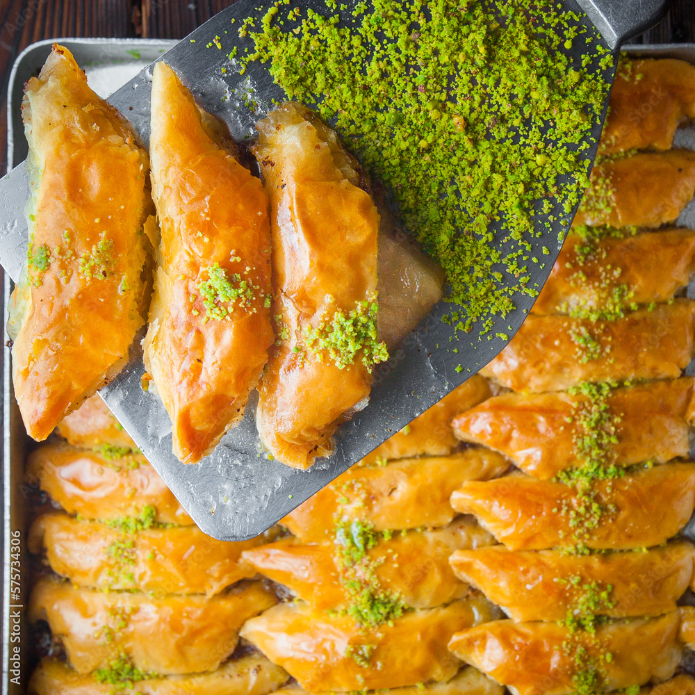 Traditional turkish dessert antep baklava with pistachio on rustic ...