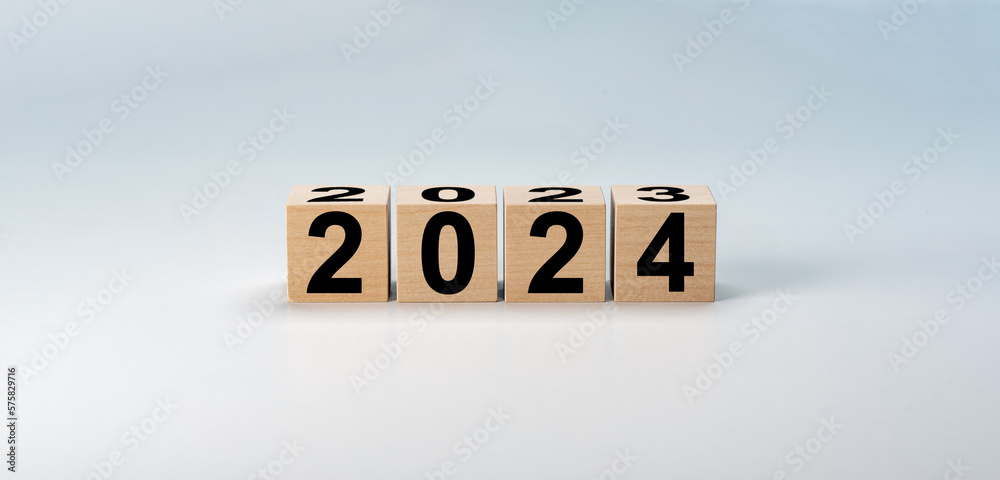2024 New Year. Wooden blocks 2024 on neutral grey background. 2023 to ...