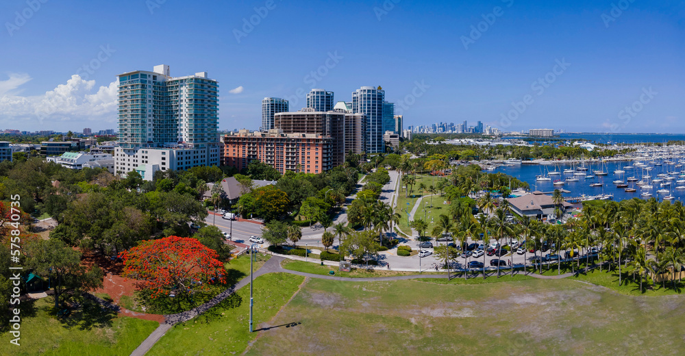 Aerial view of a park near modern city buildings near the harbor at ...