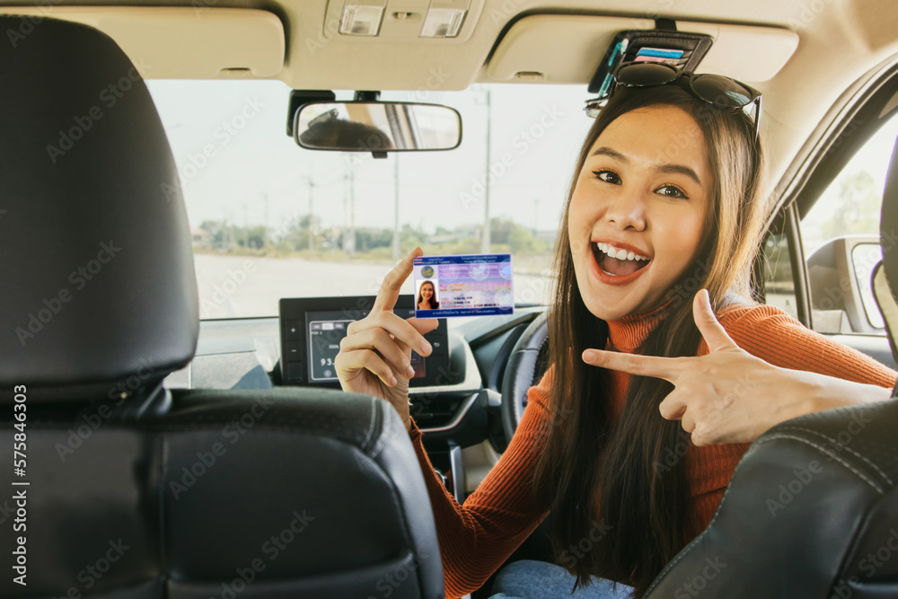Portrait young asian woman sitting in her car show ownership of ...