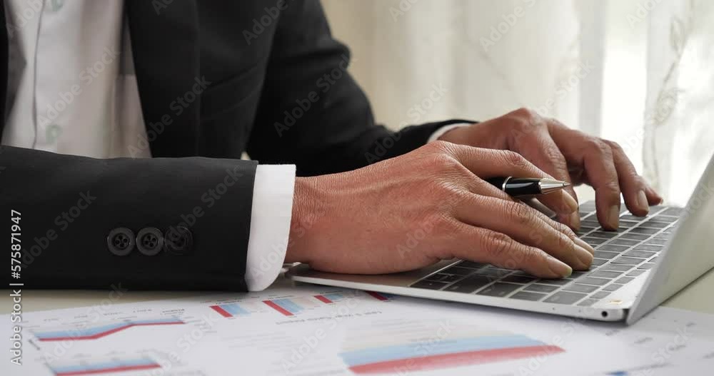 Closeup businessman hands working use laptop finance business document ...