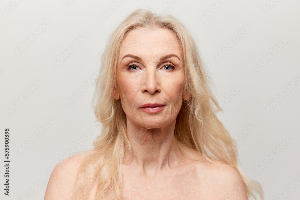 Portrait of beautiful middle-aged woman with healthy, natural condition ...