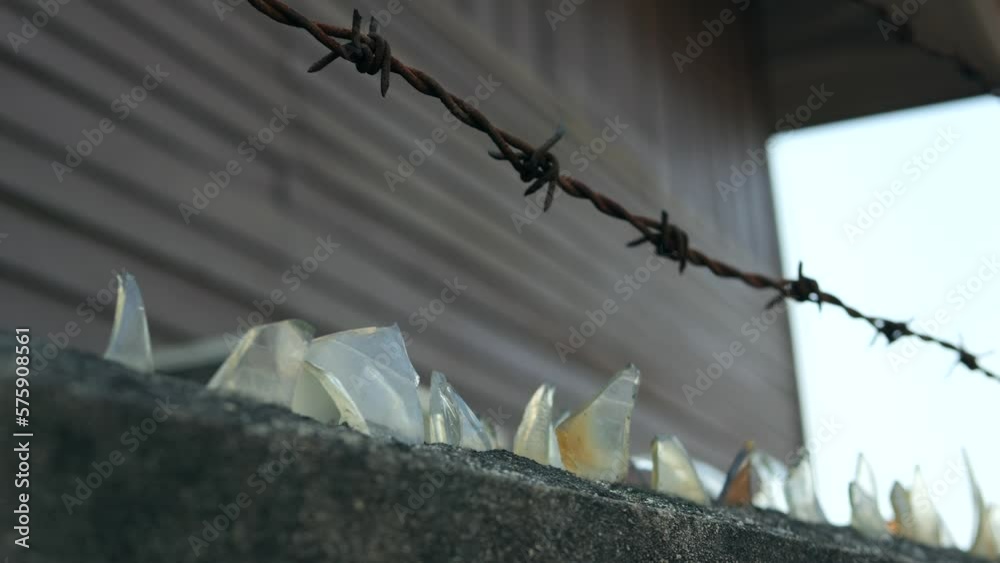 Video Stock Concrete Fence Wall With Broken Bottle Glass and Rusted ...