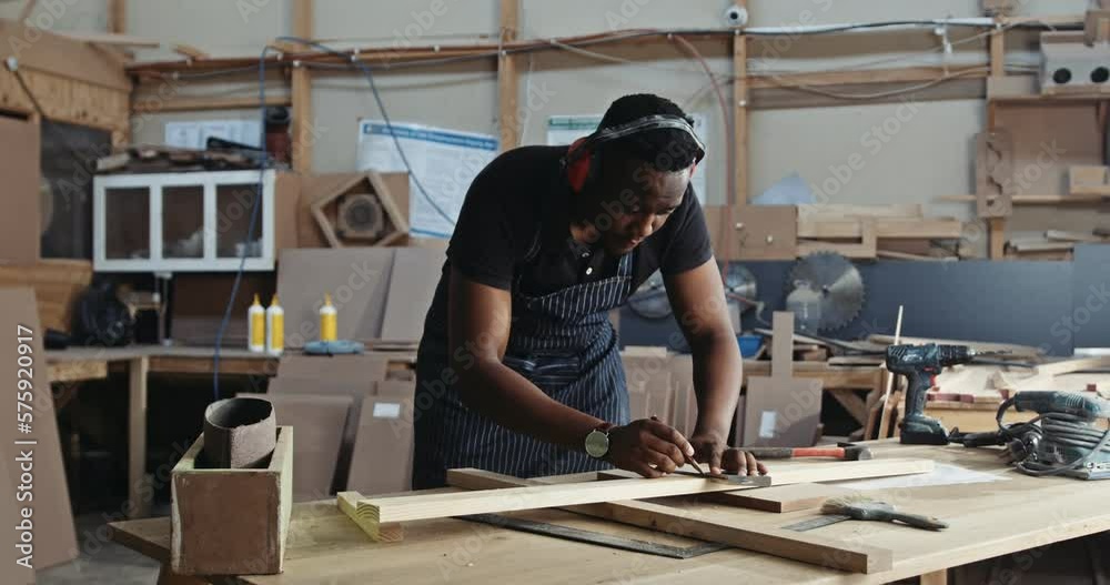 African carpenter very focused on his new wood work design. Stock Video ...