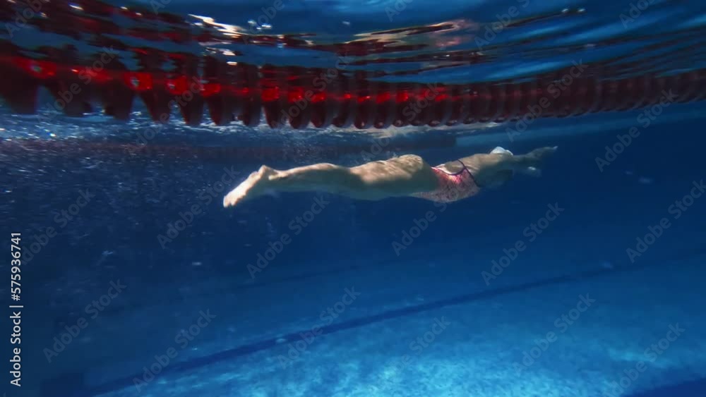 Coordinated movements. Competitive woman, professional female swimmer ...