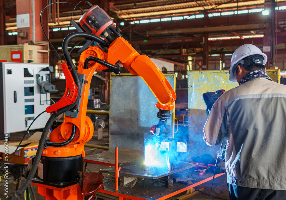 Robotic Welding Machine, Technicians Welding a Steel Plate of Steel ...