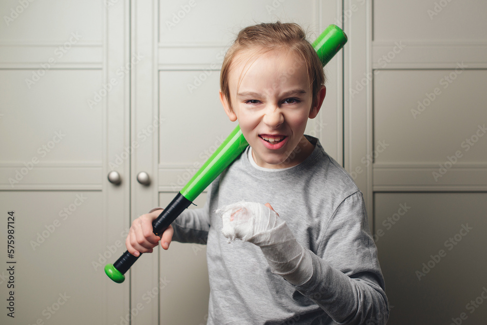 Teenager with broken arm. Boy holding baseball bat. Kid with broken ...
