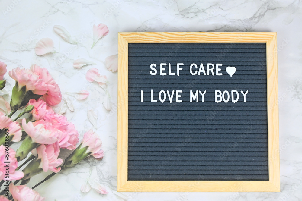 Grey letter board with phrase Self care I love my body. Self love ...