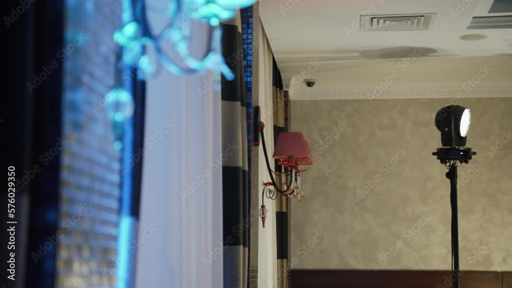 Illumination of banquet hall changing color and illuminating walls with ...